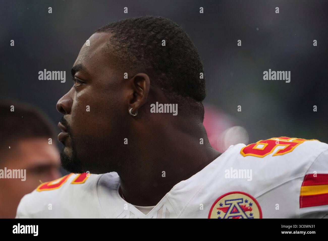 Kansas City Chiefs defensive tackle Chris Jones looks on before an NFL preseason football game ...