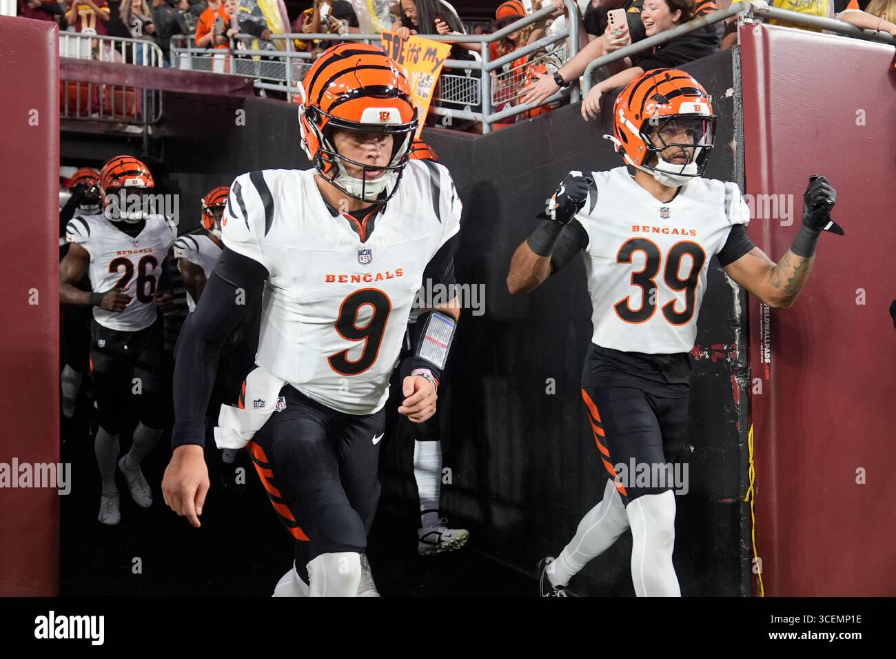 Cincinnati Bengals quarterback Joe Burrow (9) and cornerback Lance ...