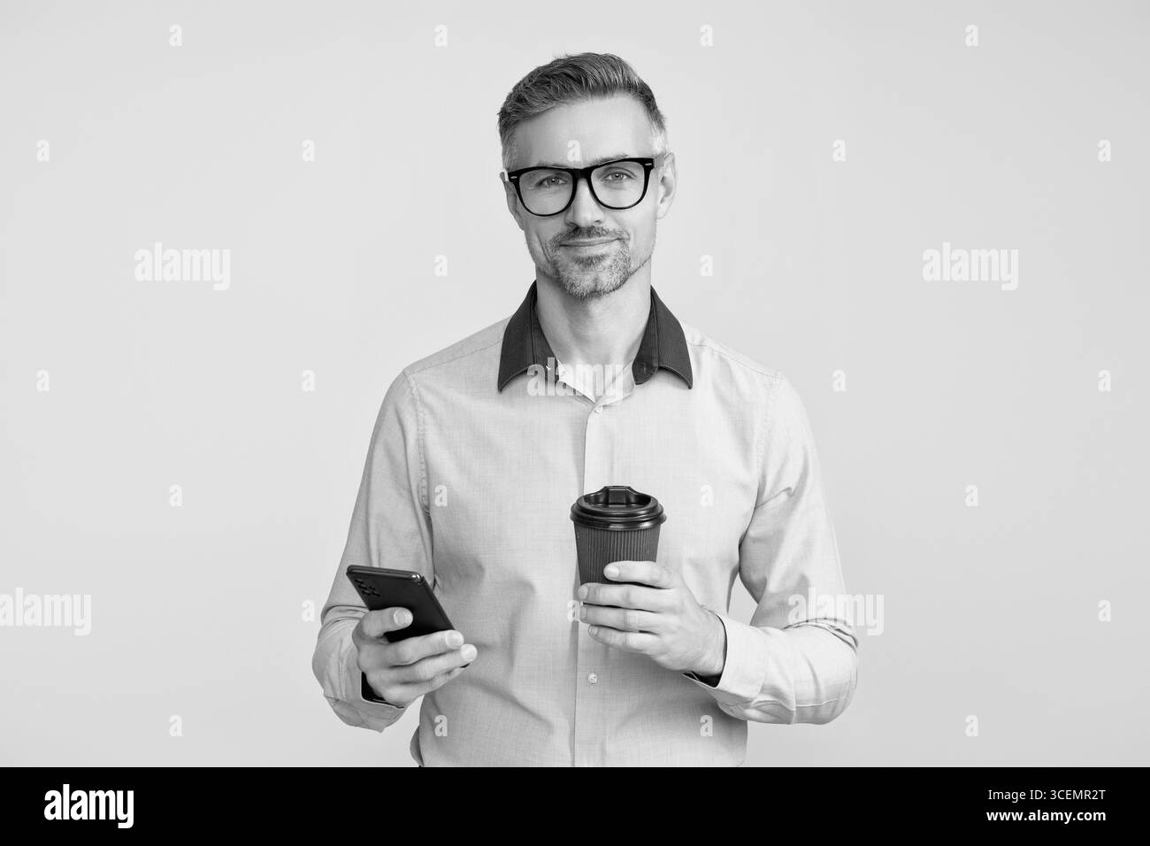 Employee messaging on smartphone Black and White Stock Photos & Images ...