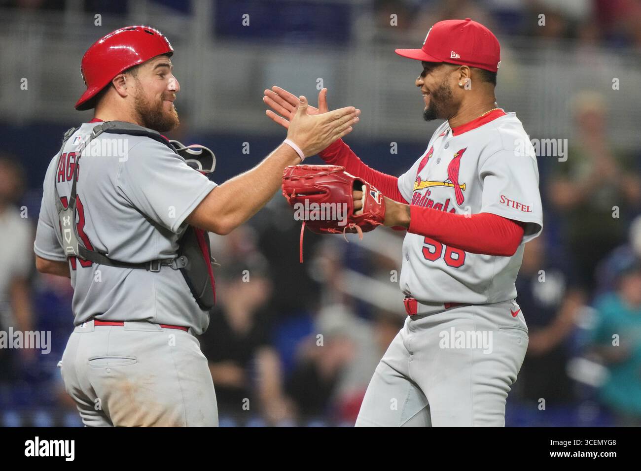 St. Louis Cardinals catcher Pedro Pages, left, shakes hands with relief ...