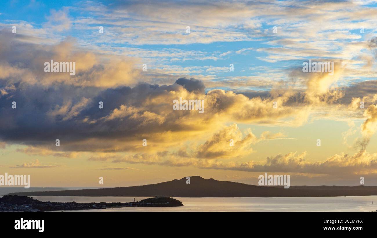 View of early morning cloud formations above North Head and Rangitoto ...