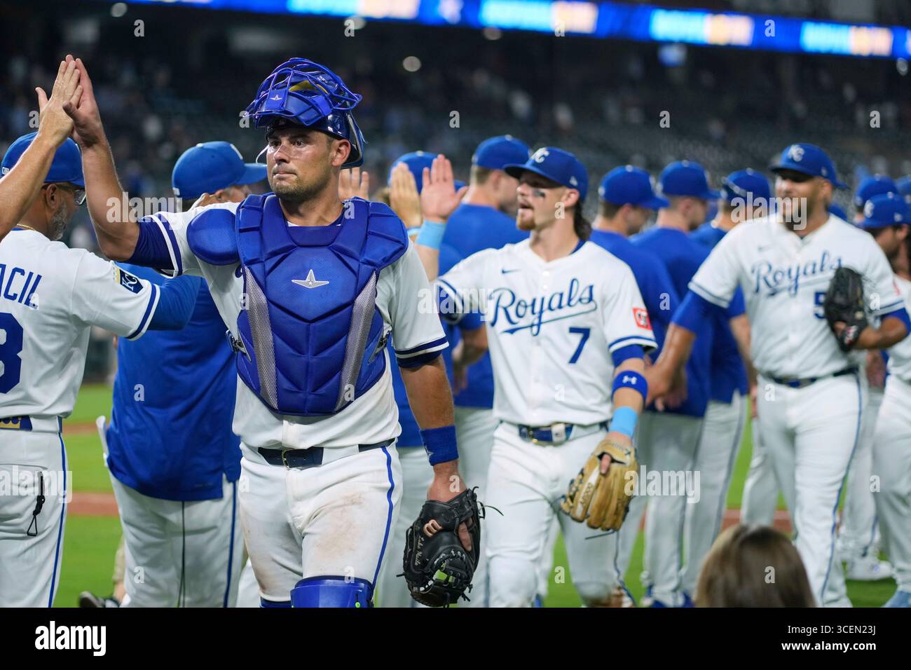 Kansas City Royals catcher Luke Maile, left, celebrates with teammates ...