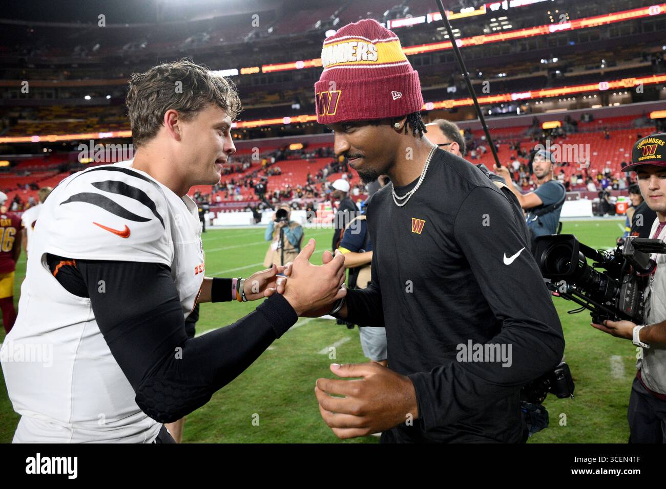Cincinnati Bengals quarterback Joe Burrow, left, and Washington ...