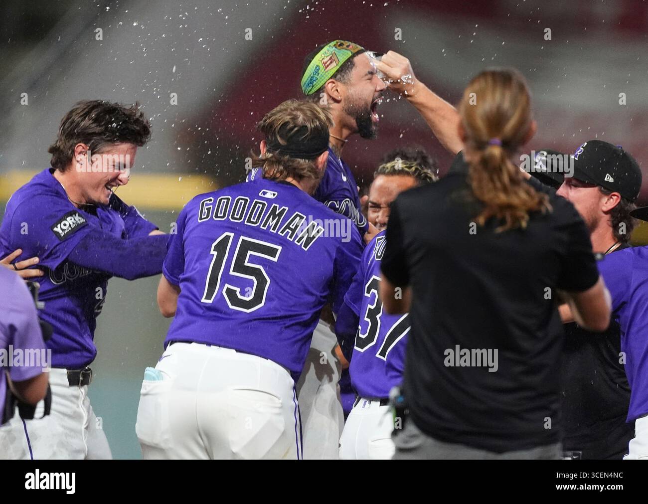 Teammates surround Colorado Rockies' Warming Bernabel, center top, to ...
