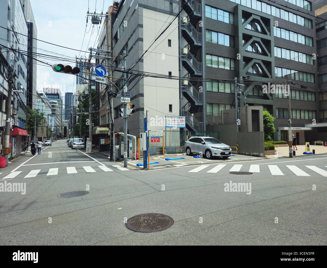 Osaka Japan Urban Street Intersection with Crosswalk and Parking Lot at ...