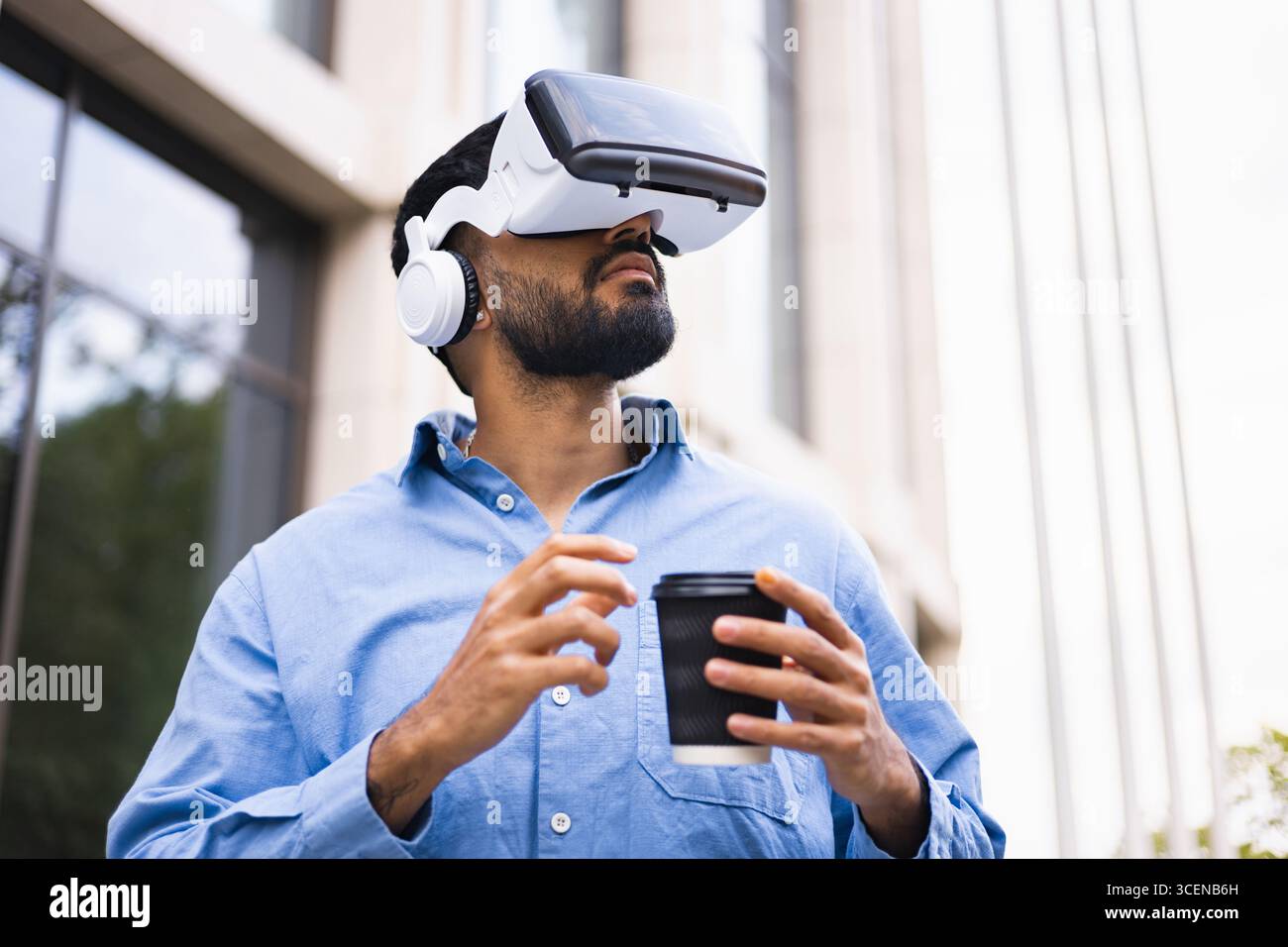 Bearded man experiencing vr reality hi-res stock photography and images ...