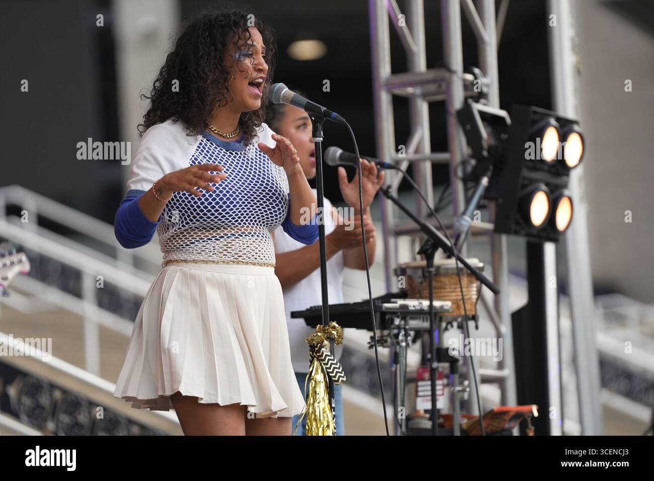Vocalist Princella Ray of the band Rub plays for fans before an NWSL ...
