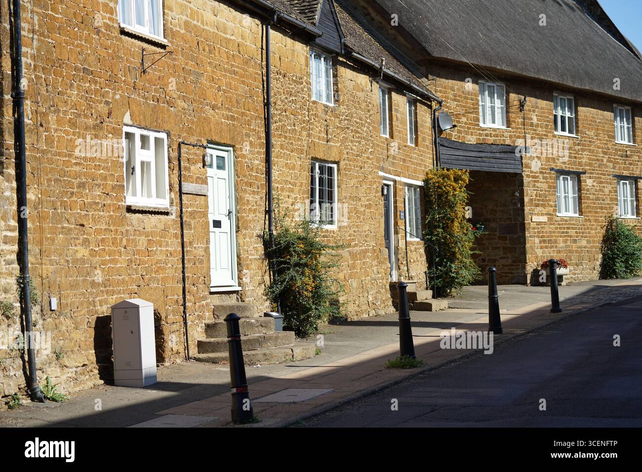 Rustic Brick Houses with Wooden Doors in a Countryside Village Street ...