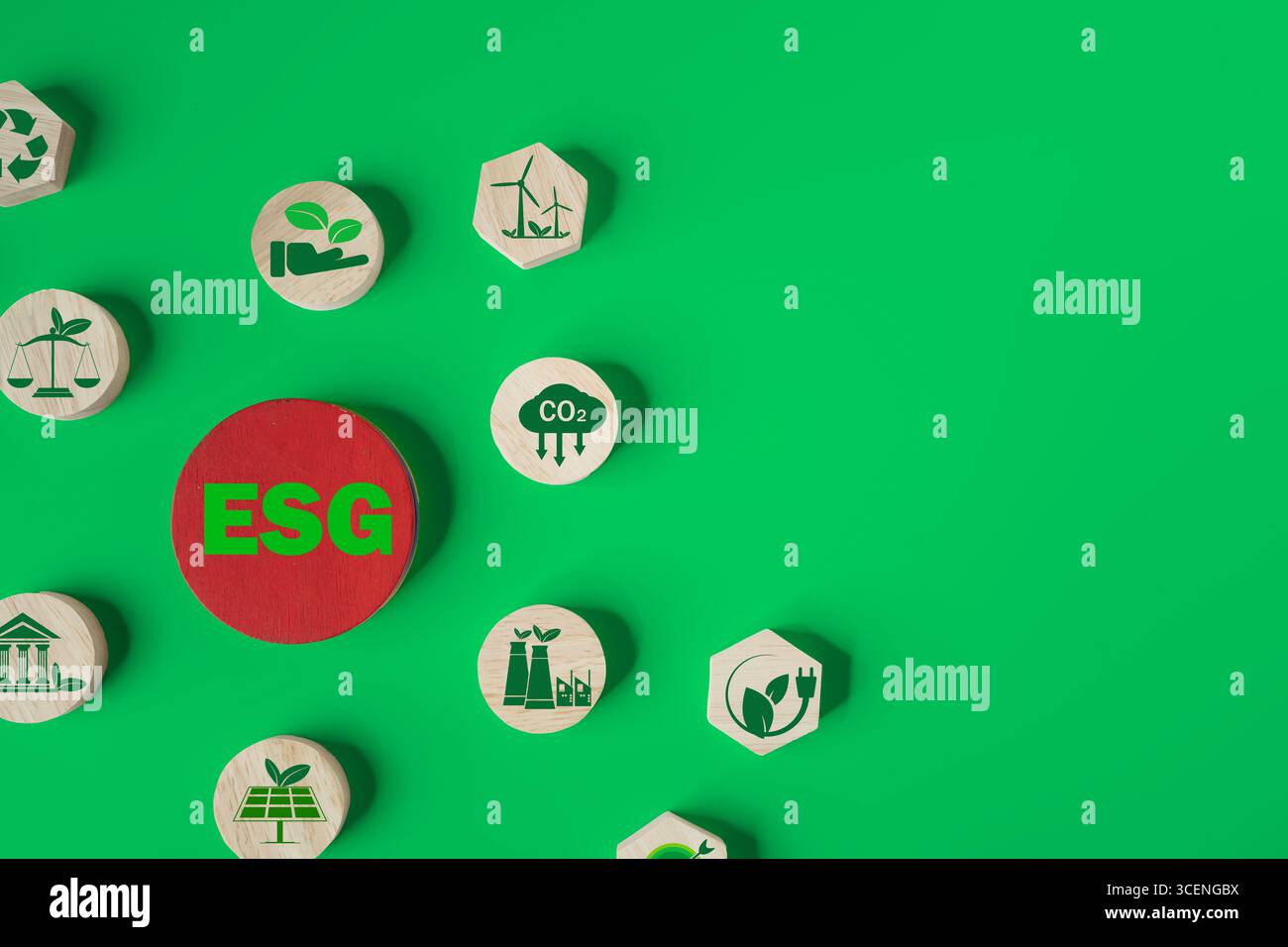 Wooden blocks with ESG letters and environmental icons on green ...