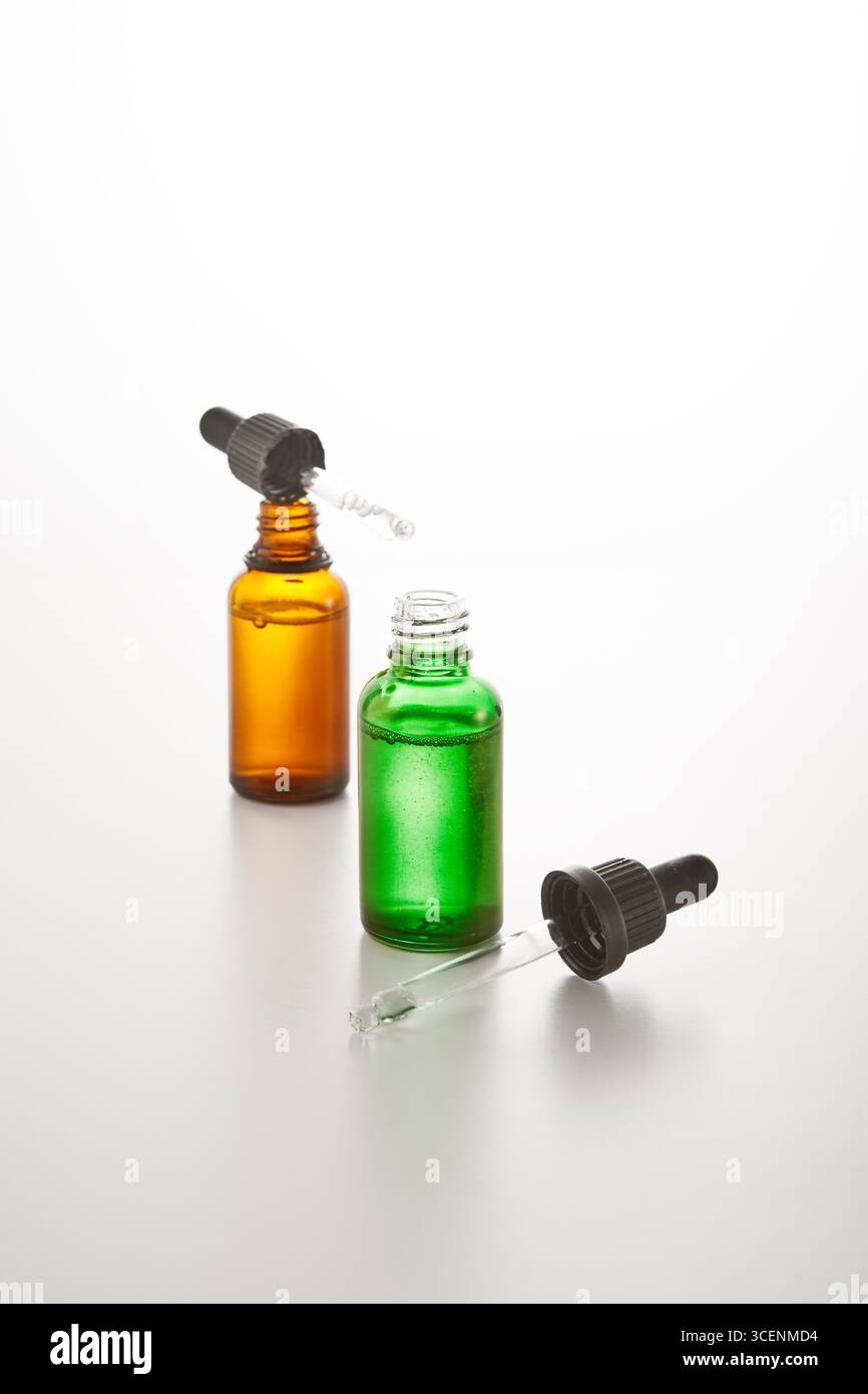 Green, amber mini bottles mockups with pipettes Stock Photo - Alamy