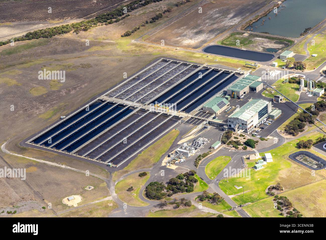 Aerial view of long, dark rectangular pools contrasting with the light ...