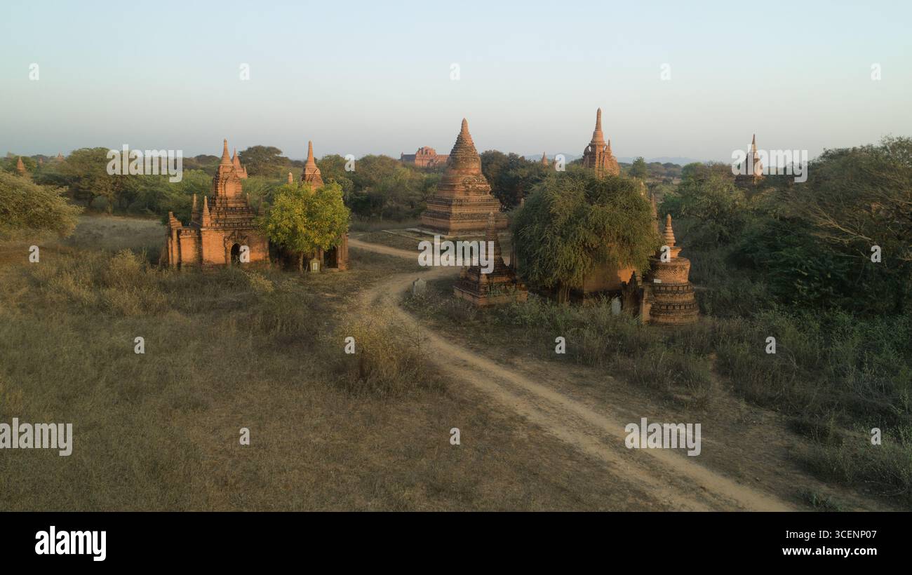 Aerial view of ancient temples rise from the golden earth, their ...