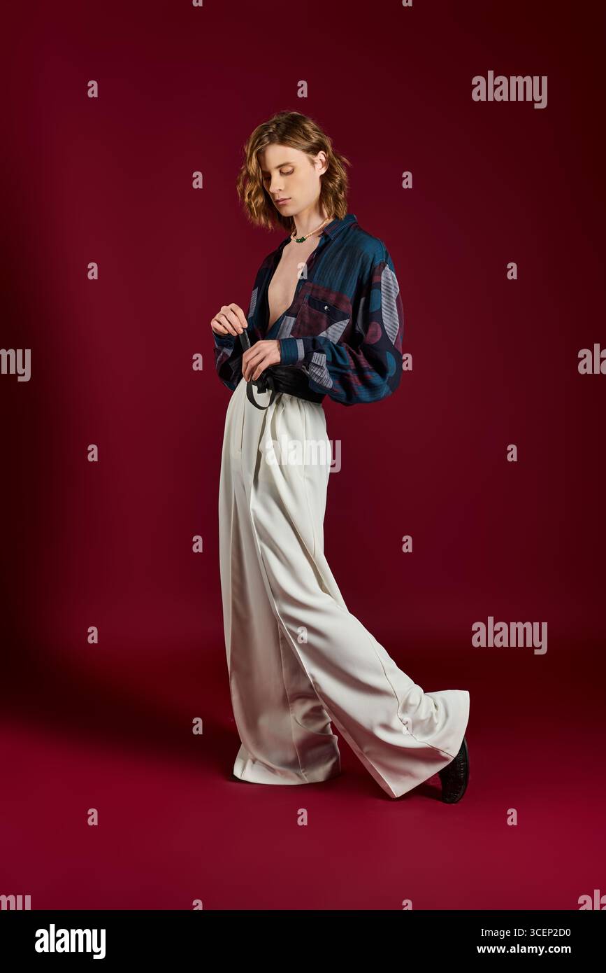 A stylish young man with a feminine touch radiates charisma against a ...