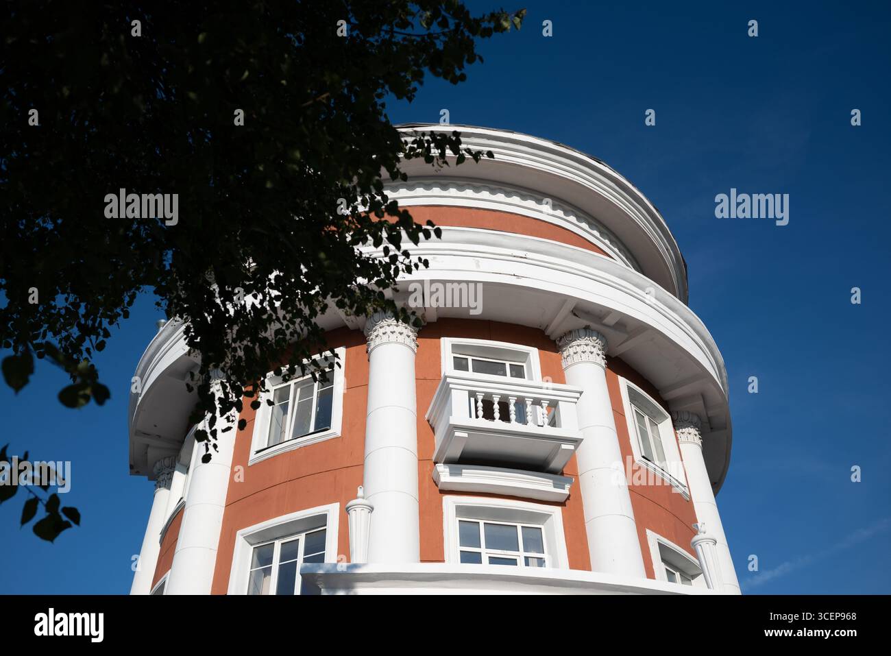 Elegant Round Building Under Clear Blue Sky Stock Photo - Alamy