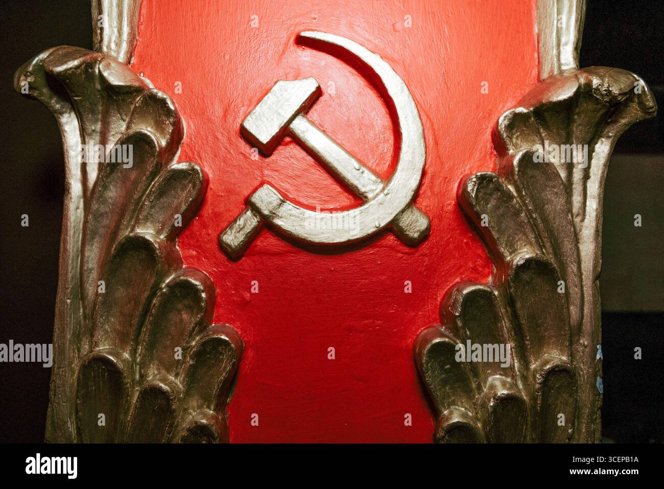 Gilded symbol of communism in the USSR, hammer and sickle, bas-relief ...