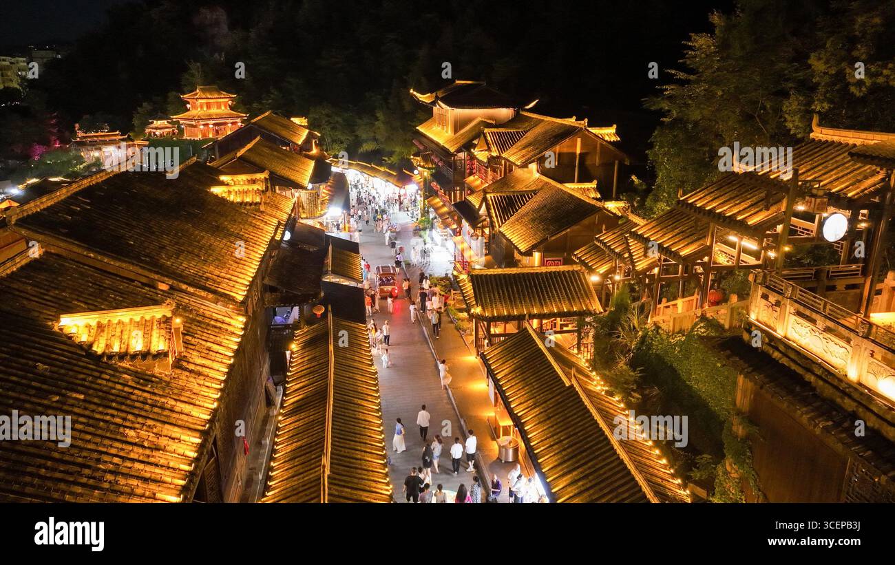 Aerial photo shows people enjoying the evening in Youzhou ancient town ...