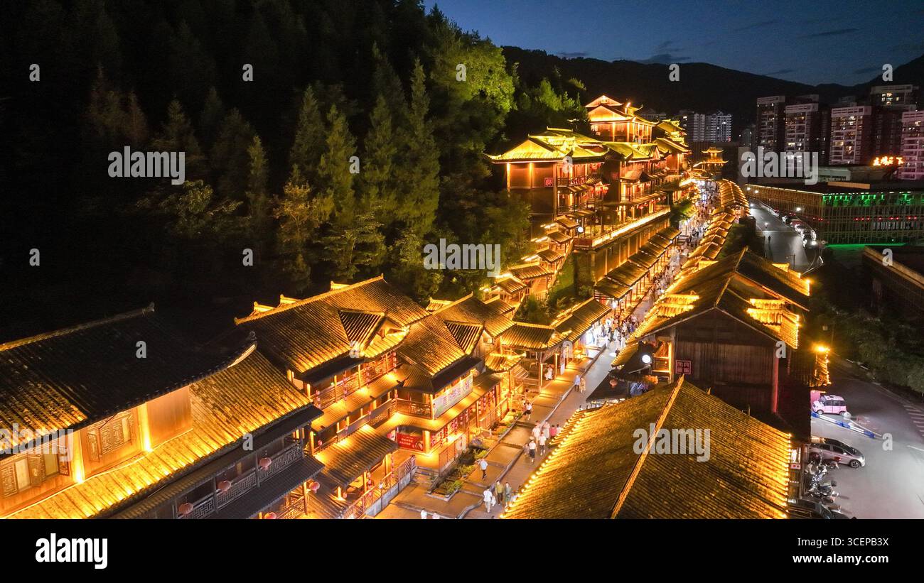 Aerial photo shows people enjoying the evening in Youzhou ancient town ...