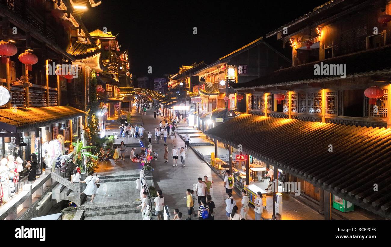 Aerial photo shows people enjoying the evening in Youzhou ancient town ...