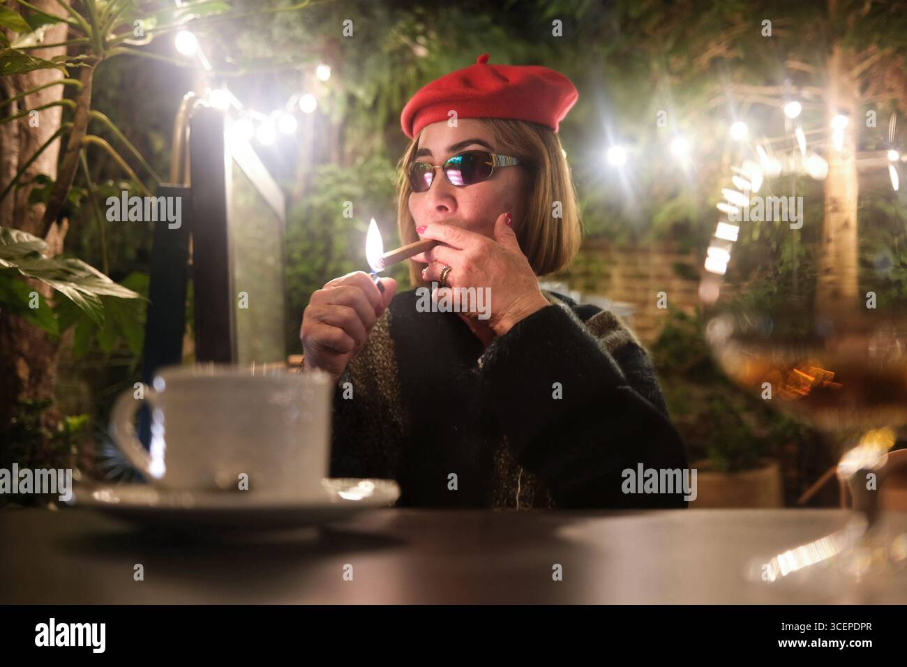 French cafe restaurant in Paris woman smoking at outdoor table Stock ...