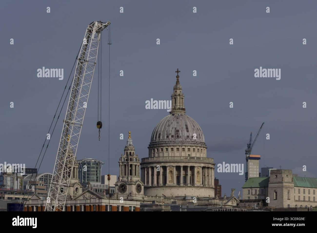 Dome of St. Pauls cathedral and mechanical cranes, City of London ...