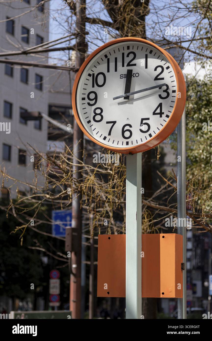 Urban design, close-up, orange Seiko clock, Ikebukuro Living Loop ...