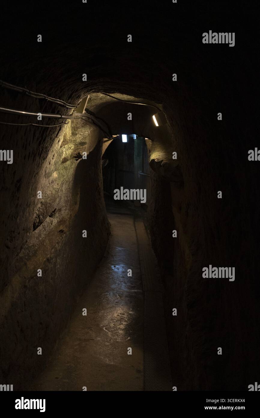Sparsely lit tunnel, sight Japanese Navy Underground Headquarters ...