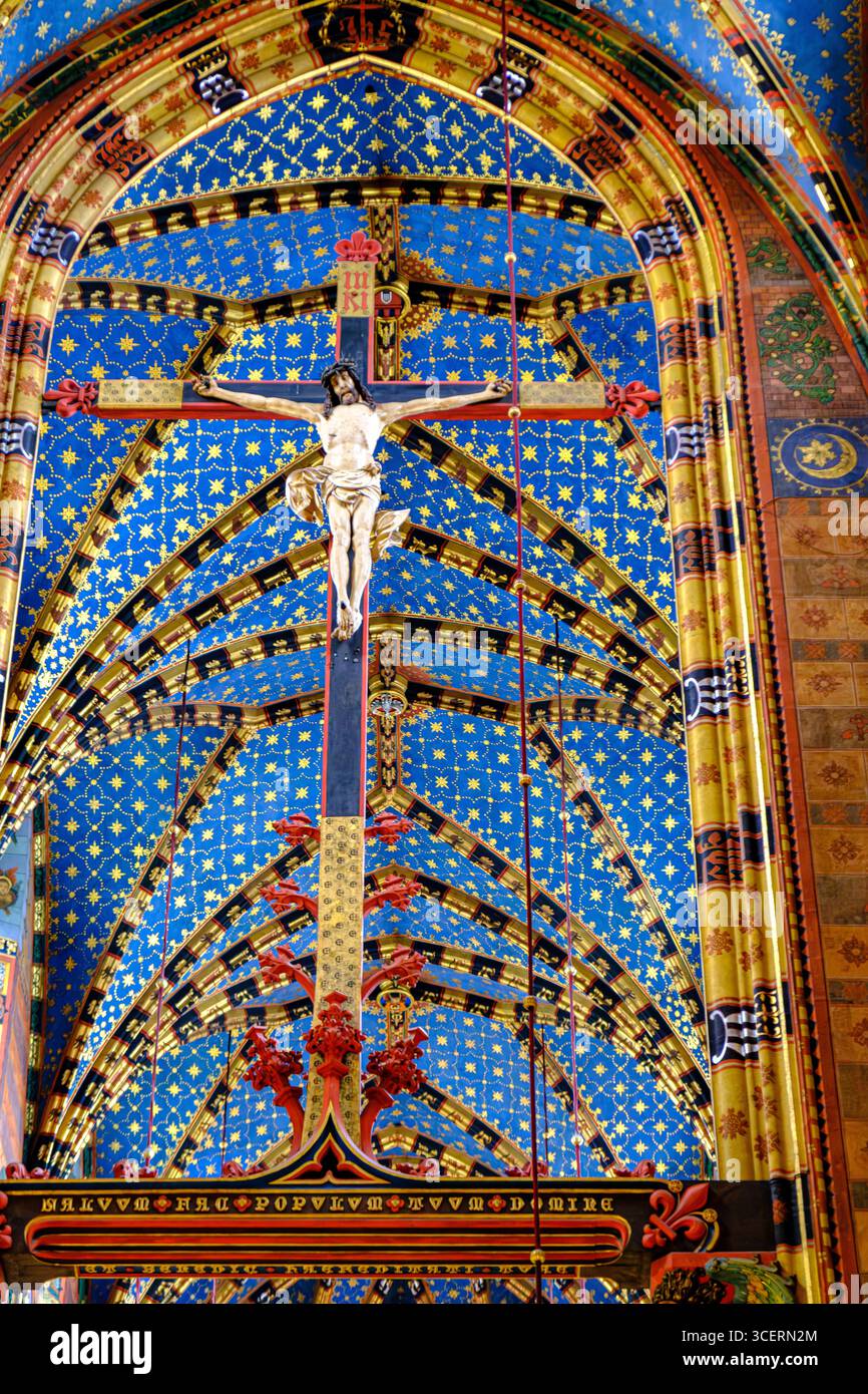 A powerful image of a gilded crucifix with a figure of Christ ...