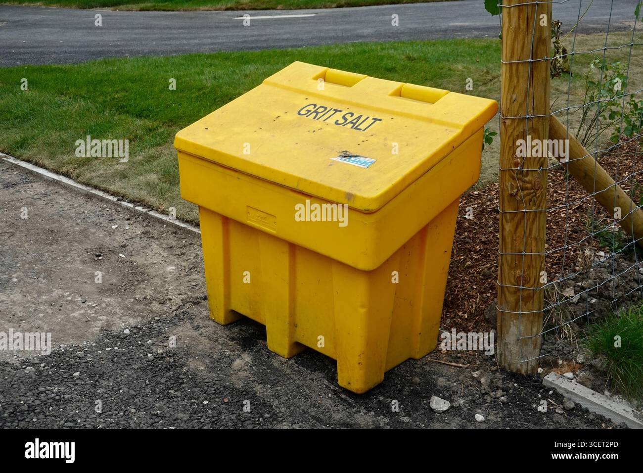 A container of grit salt to put on path when frozen Stock Photo - Alamy