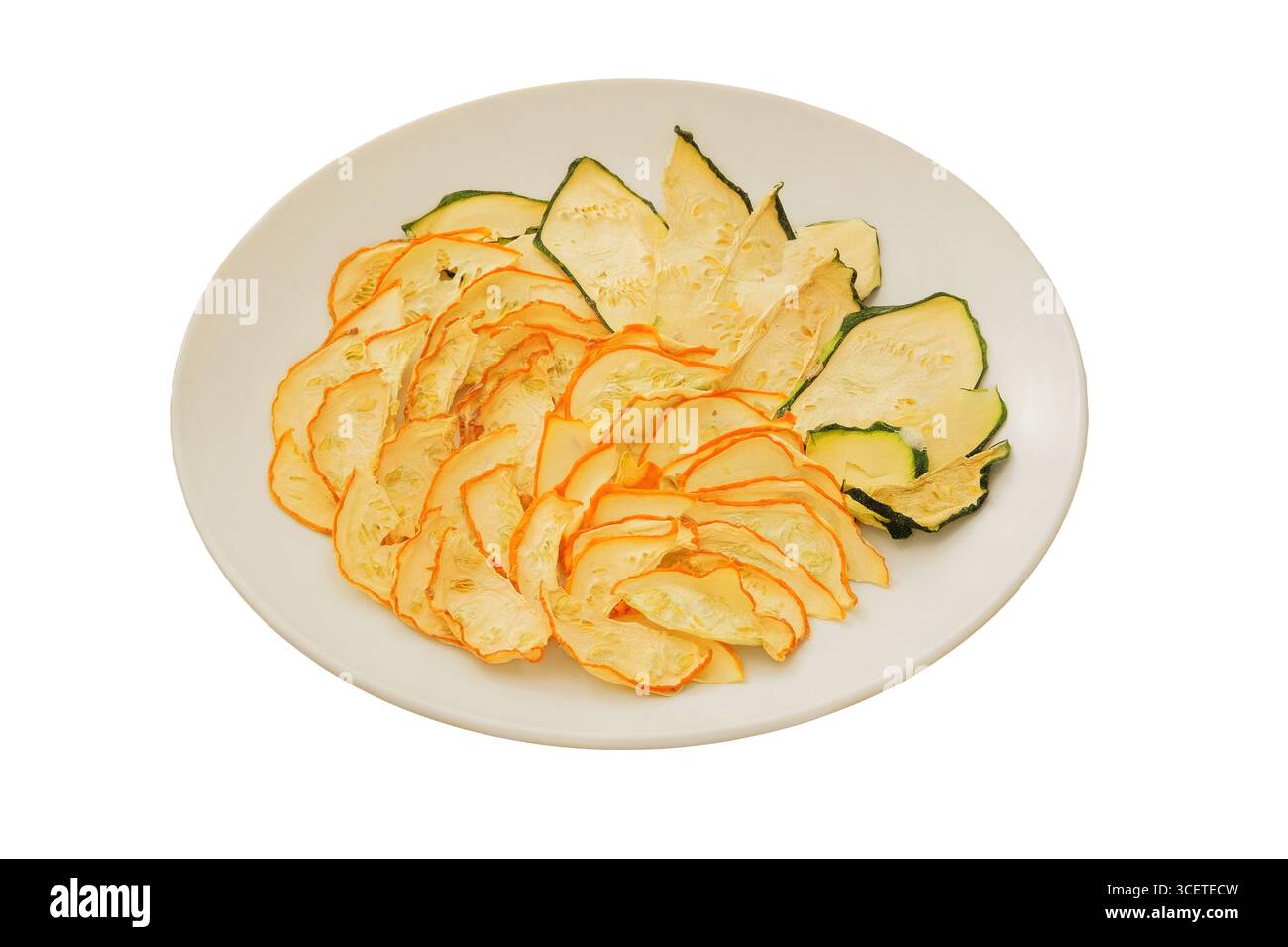 Dried zucchini on a ceramic plate isolated on a white background ...
