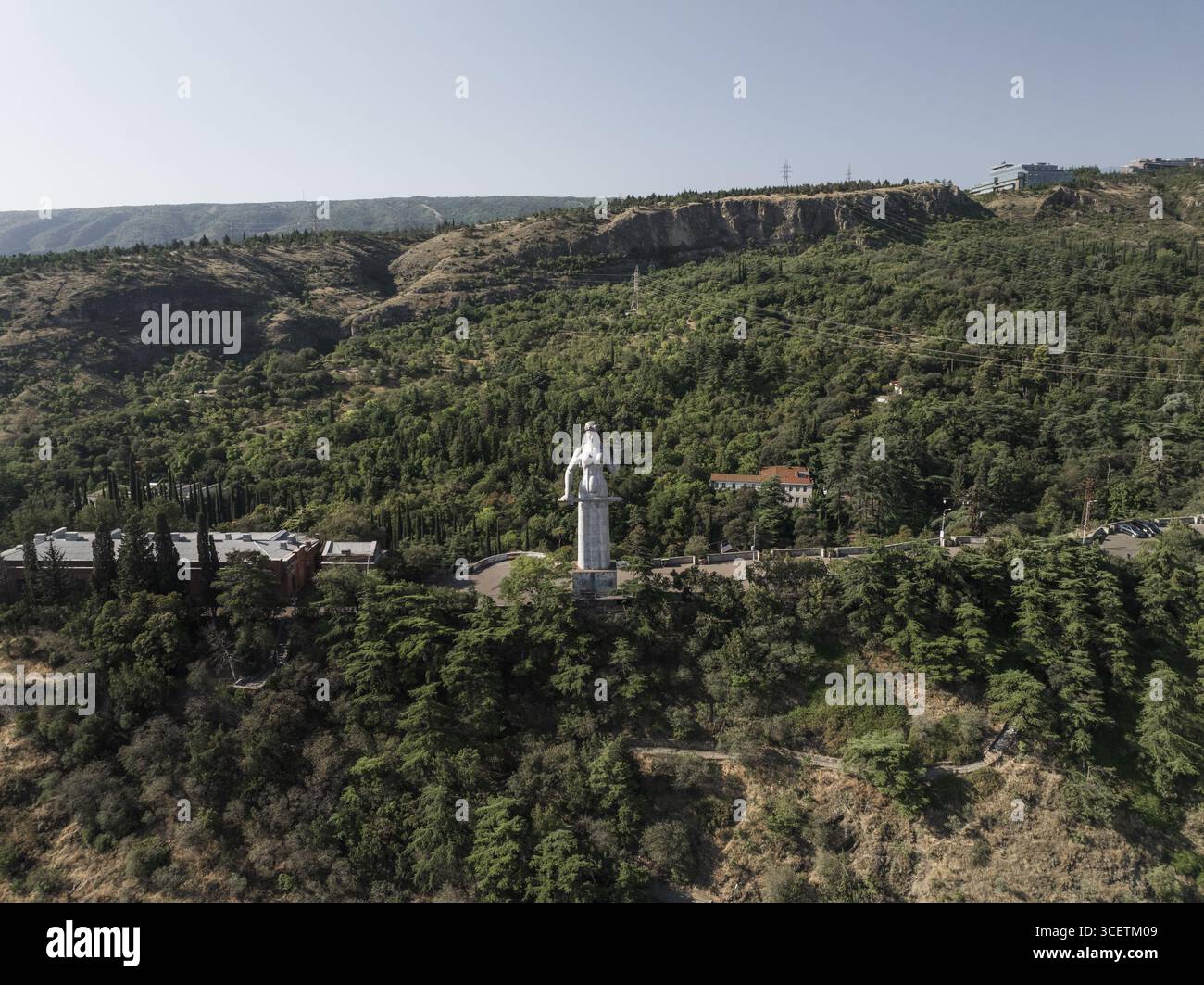 Aerial view of the majestic Kartlis Deda statue stands sentinel atop ...