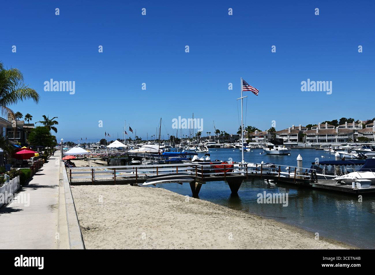 NEWPORT BEACH, CALIFORNIA - 01 AUG 2025: Boardwalk and sand at Balboa ...