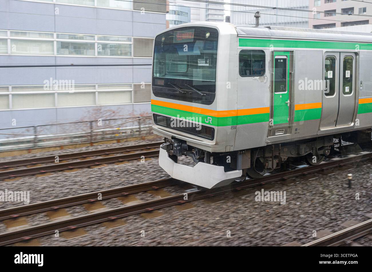 East Japan Railway Company train with orange and green stripe, Tokyo ...