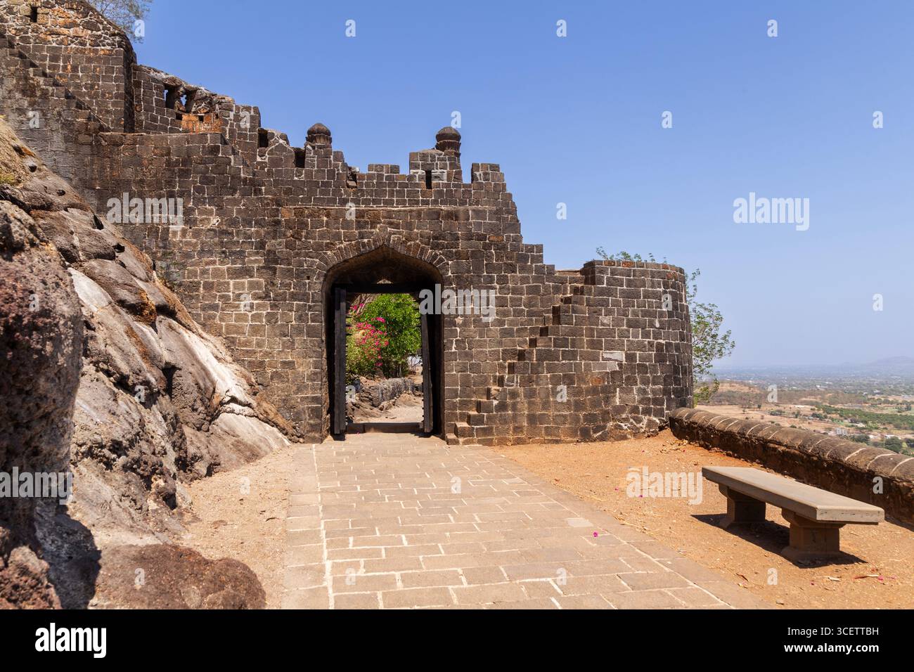 Ancient stone fort gateway with arched entrance and surrounding walls ...