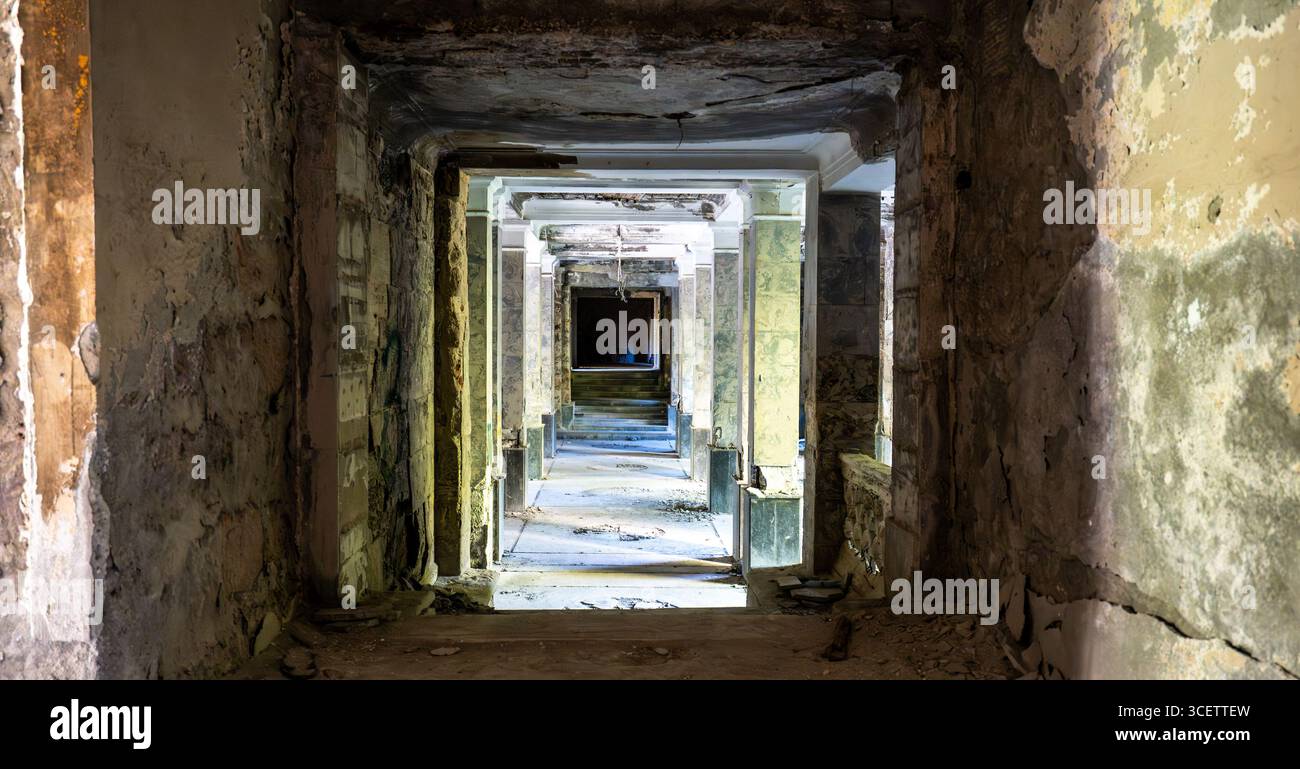 Abandoned corridor with ruined walls, debris, cracked textures ...