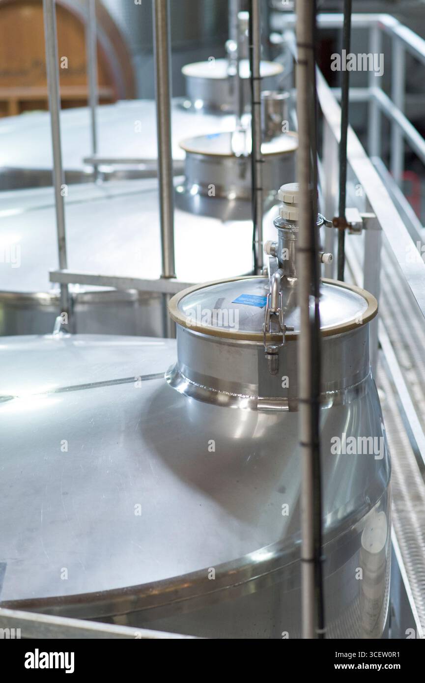 Temperature controlled metal tanks used in the fermenting process of ...