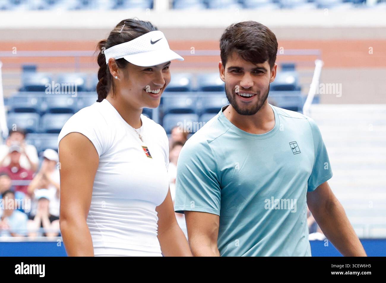 Emma Raducanu of Great Britain and Carlos Alcaraz of Spain react after ...