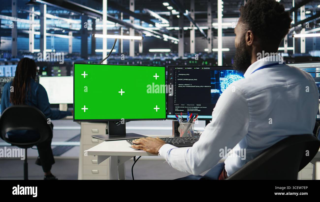 Data center admin using AI node tree software on isolated screen PC to ...
