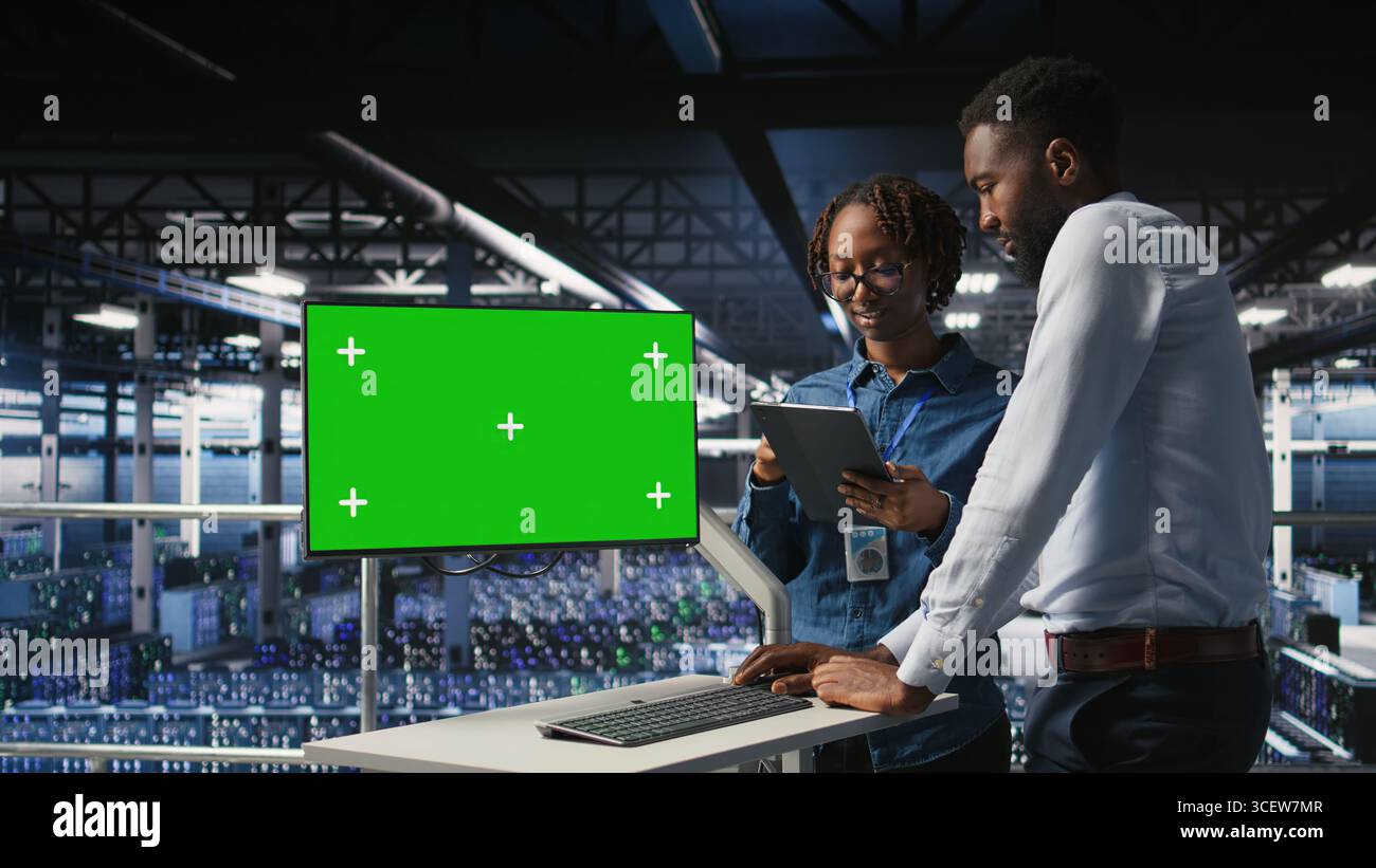 Data center engineering team coding on green screen PC, monitoring AI ...