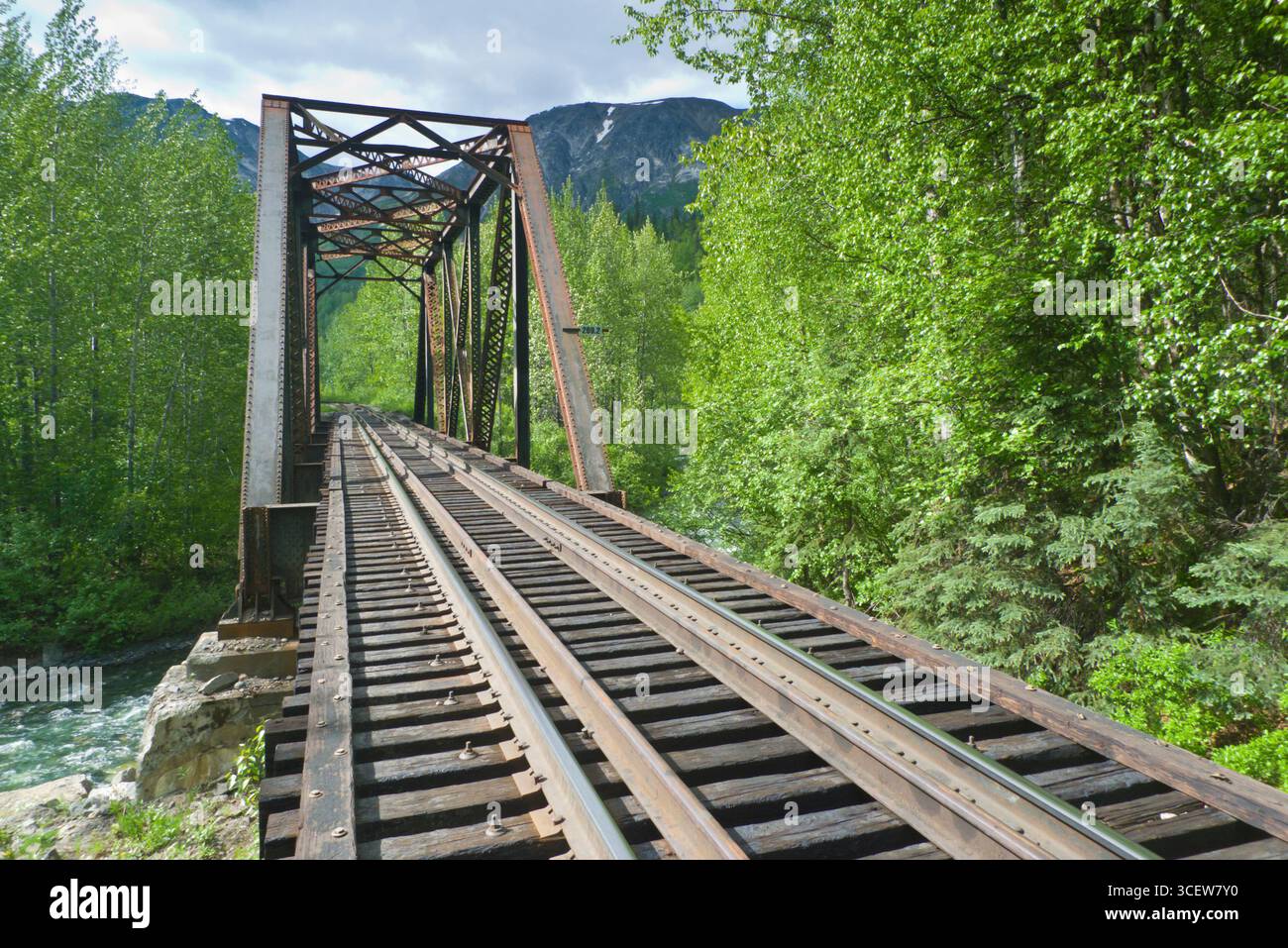 Metal railroad bridge spanning the Indian River, Talkeetna Mountains ...