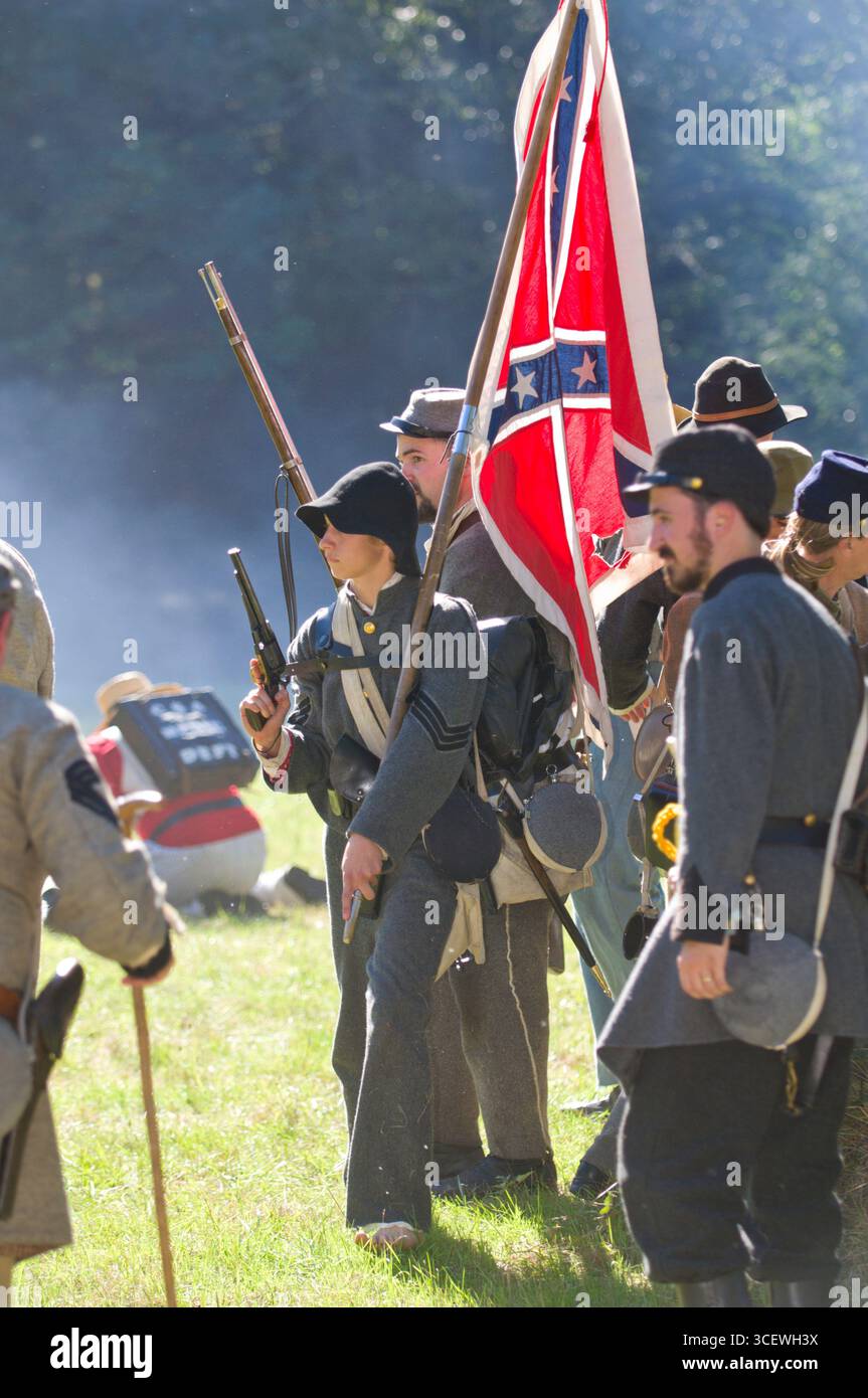 Young Confederate soldier carrying Confederate flag at Civil War ...