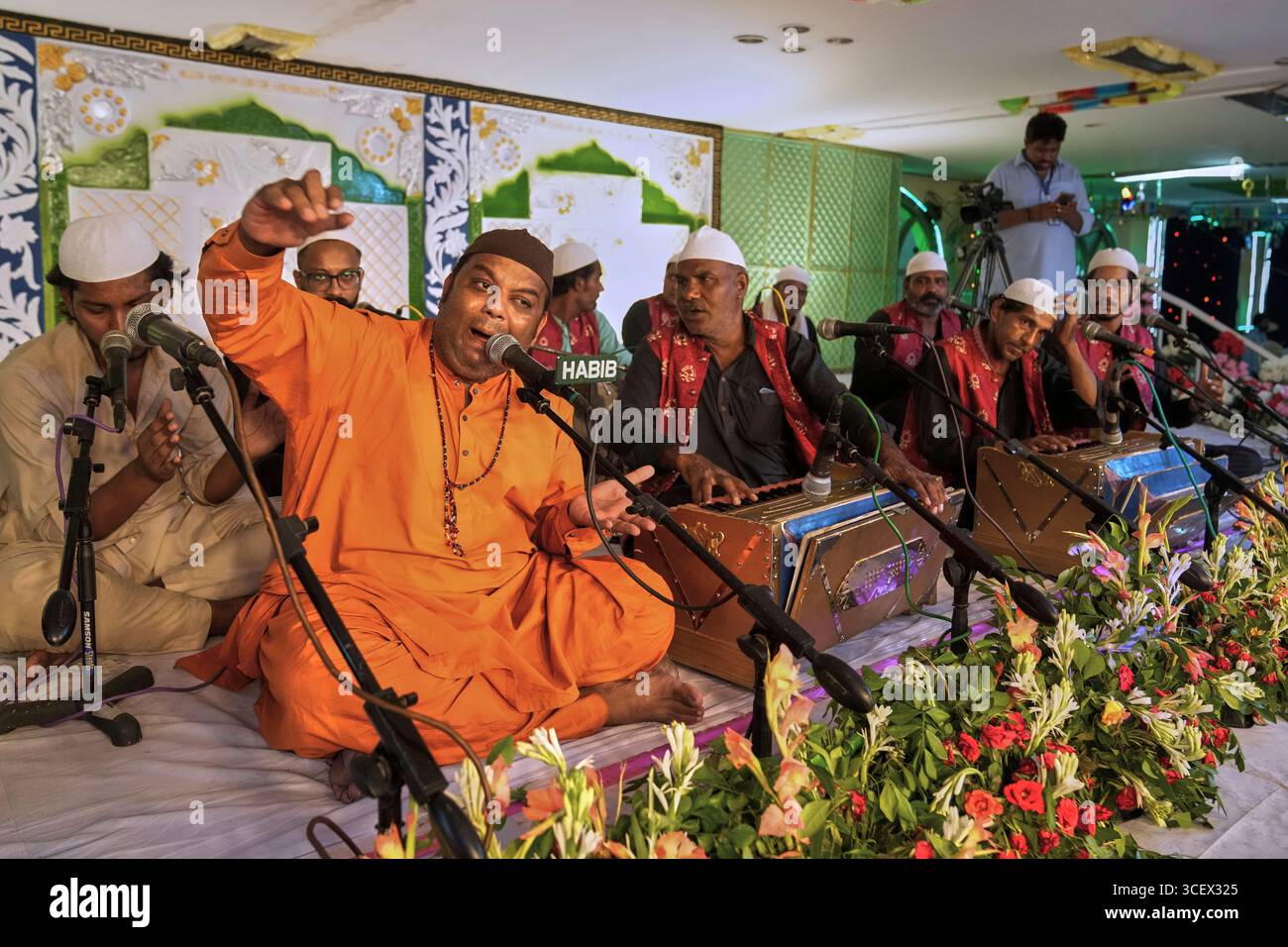 A group of singers perform 'Qawwali', a form of Sufi devotional music ...