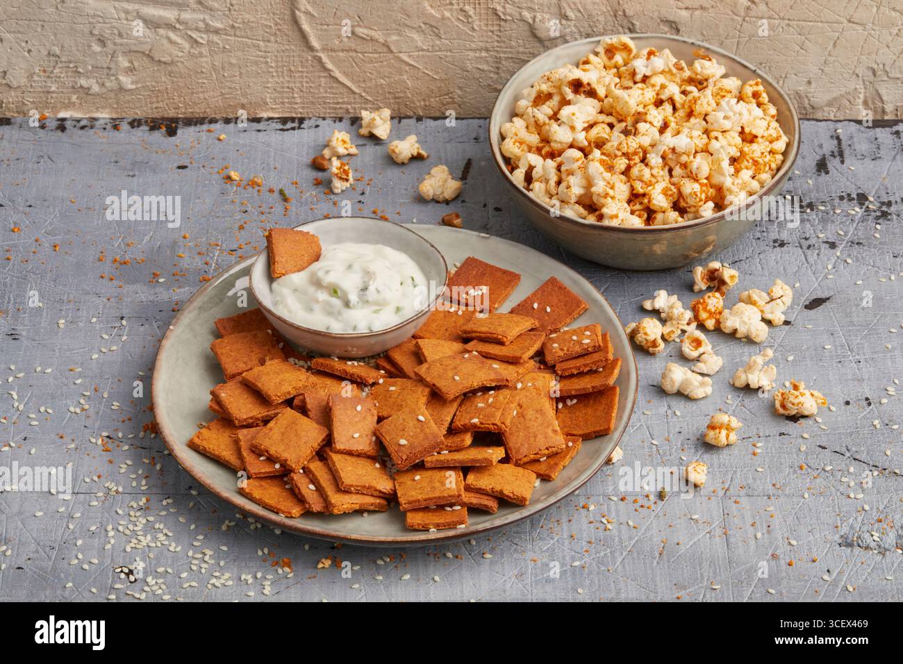Popcorn and almond crackers Stock Photo - Alamy