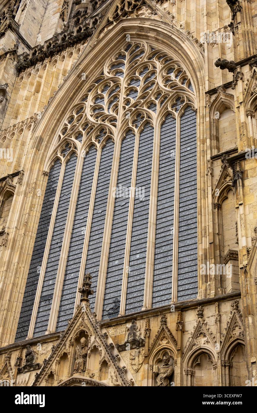 Exterior view of a historic Gothic cathedral featuring a tall stained ...