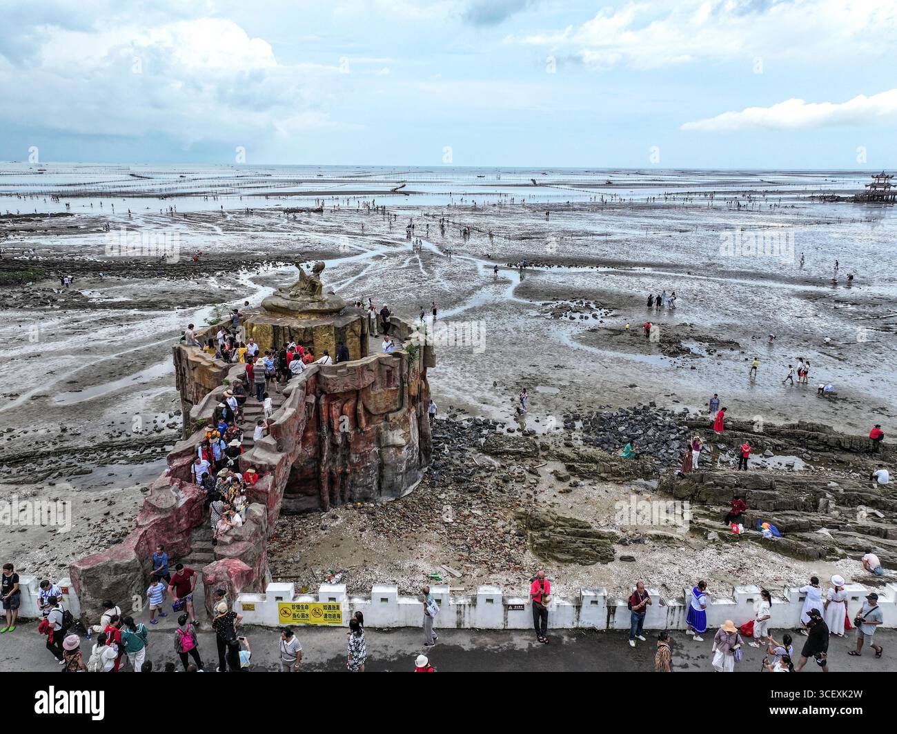 People go beachcombing in Fangchenggang City, south China's Guangxi ...