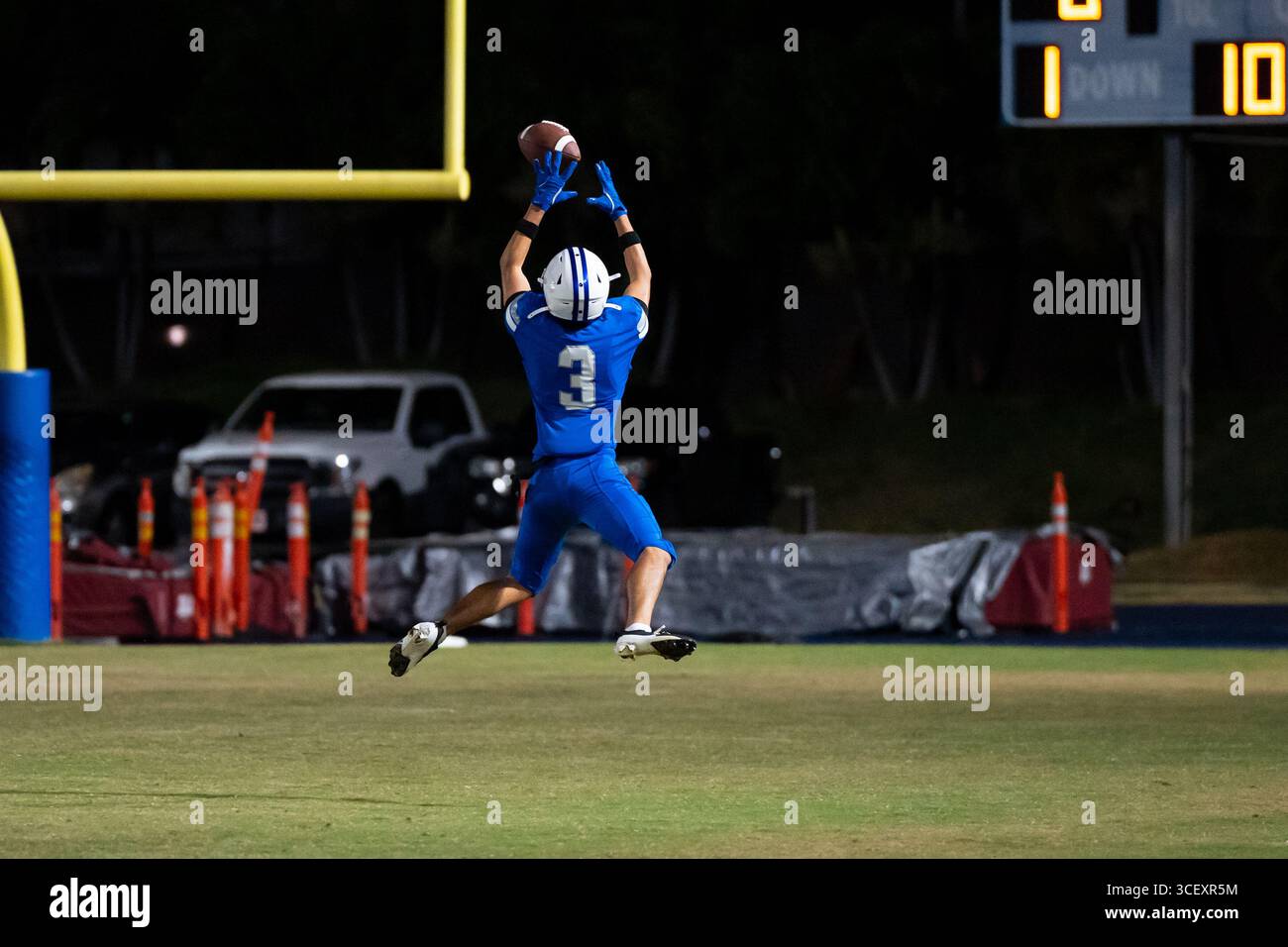 American Football Football player leaps mid-air under goalpost for ...
