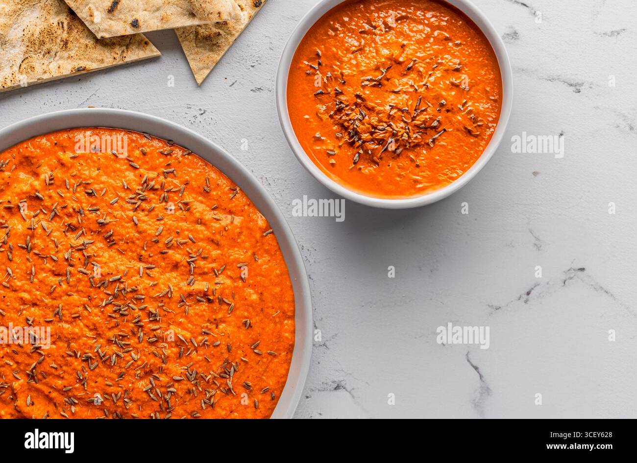 Rustic red pepper dip served with crusty bread, Mediterranean appetiser ...