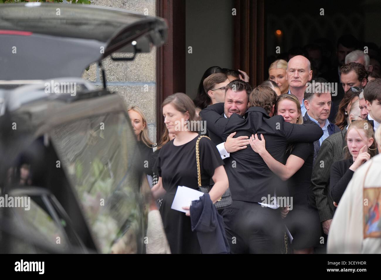 Mourners embrace following the funeral of Martha Nolan-O'Slatarra at ...
