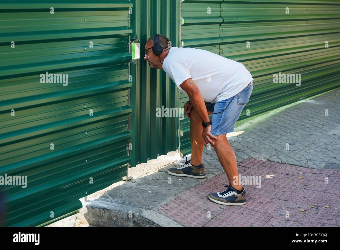 A Betis fan looks at the construction site of the Real Betis stadium ...