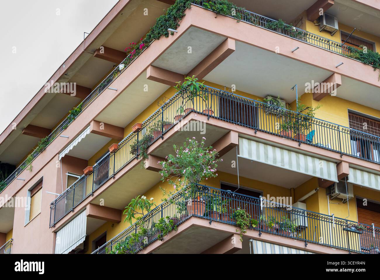 Urban bloom balconies overflow with greenery, turning a residential ...