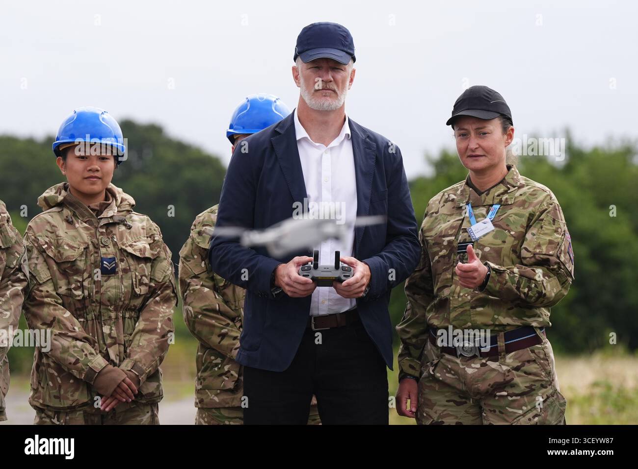 Minister for Veterans and People, Al Carns operates a drone as he ...